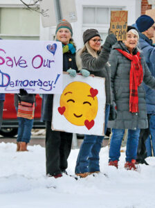 Pg 4A SA Smiley face at protest | Addison Independent