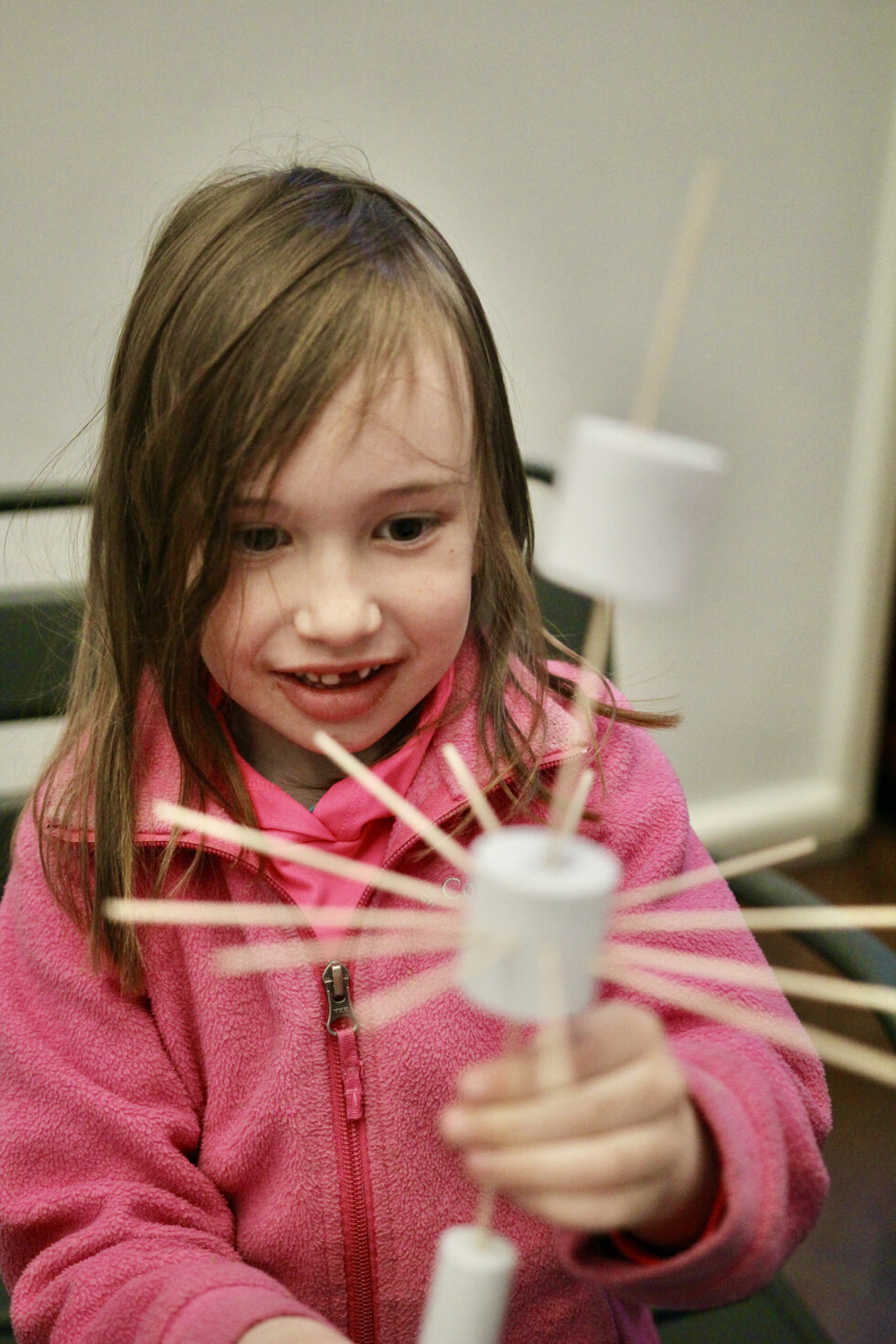 Libby Mason, 6, of Middlebury, admires her work_ | Addison Independent